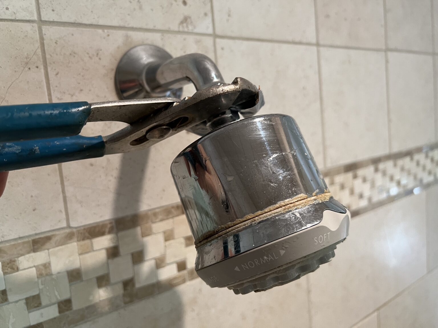 How to Clean a Clogged Shower Head | HomeTips